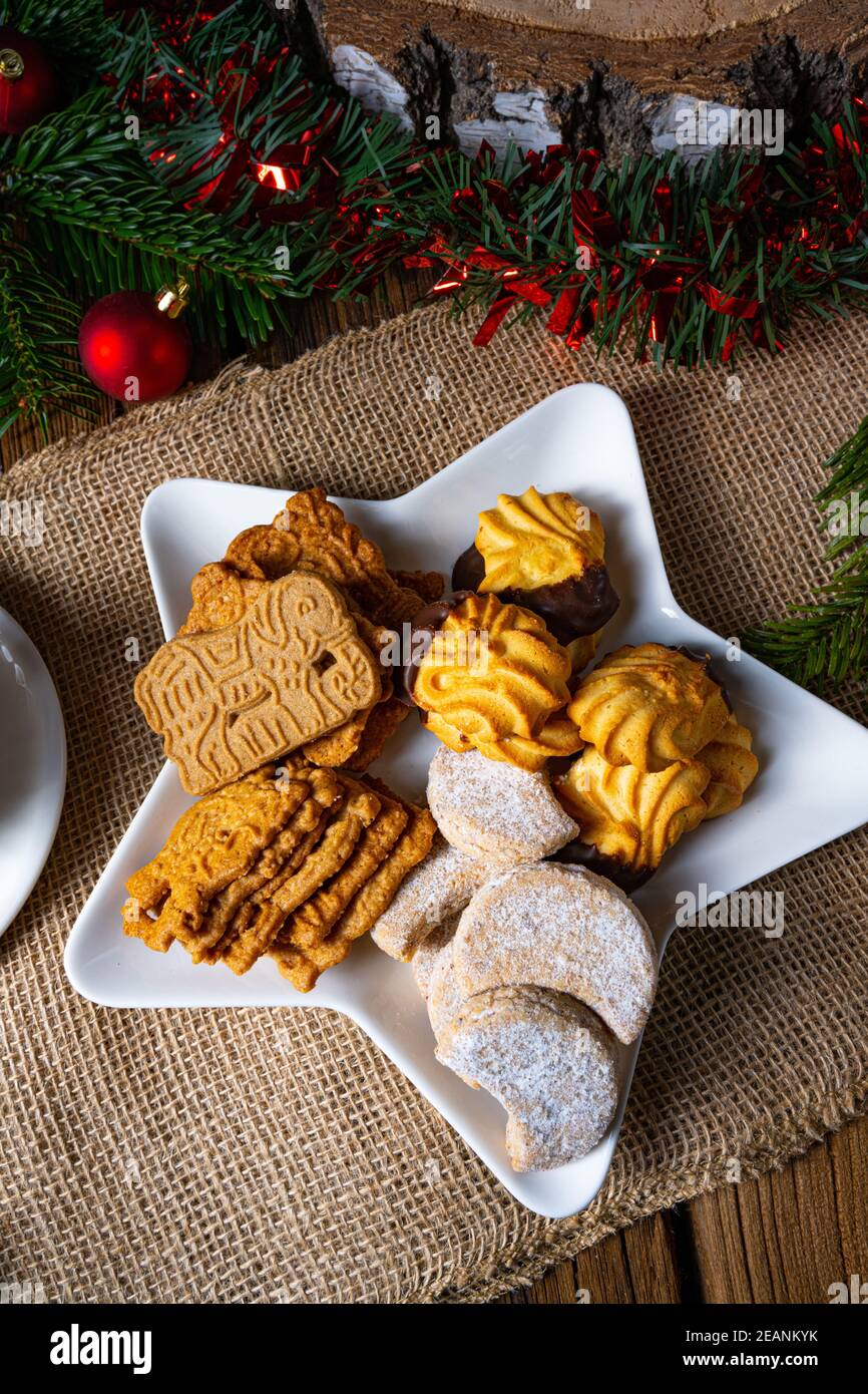 Different types of biscuits with rustic Christmas decorations Stock ...