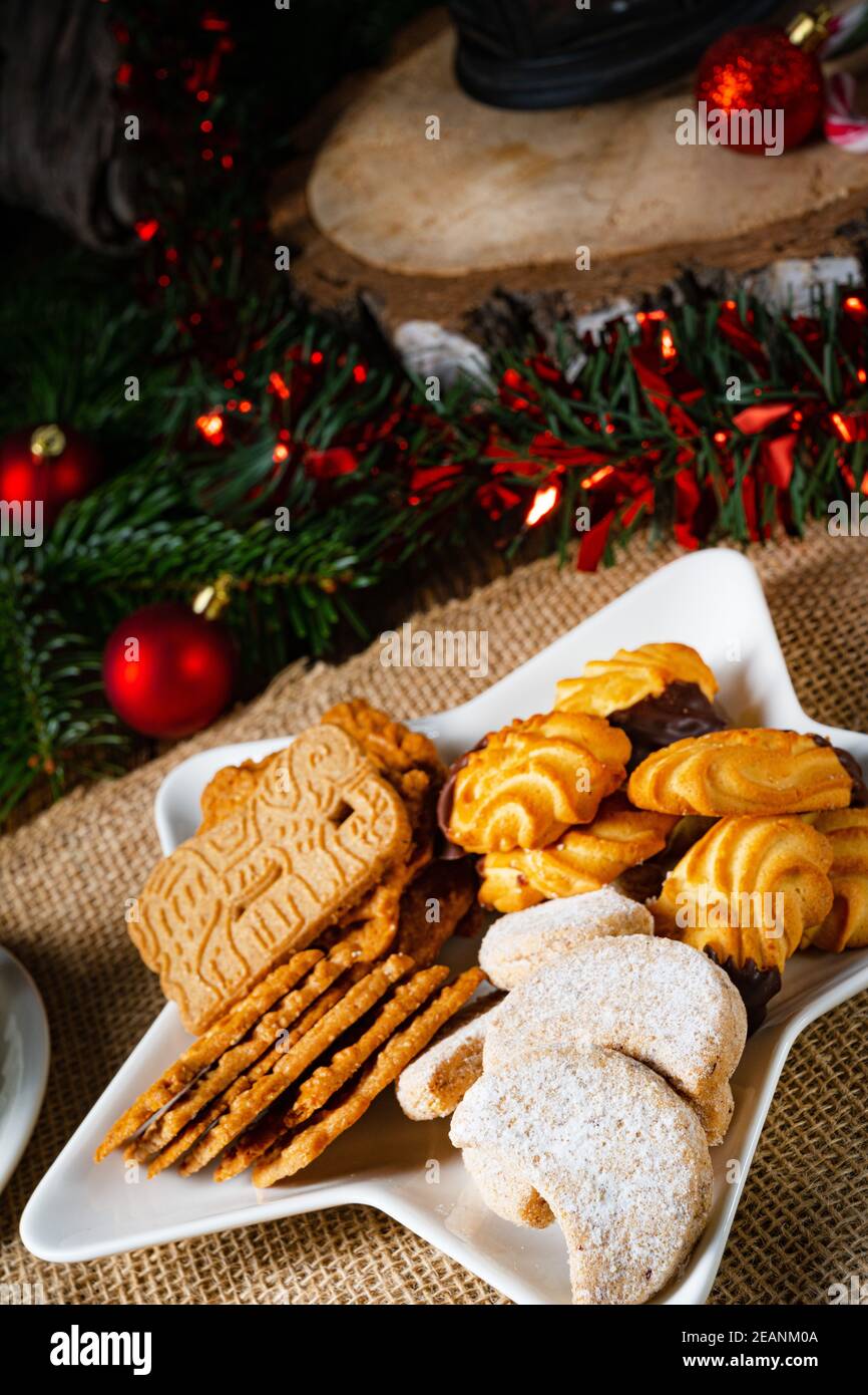 Different types of biscuits with rustic Christmas decorations Stock ...