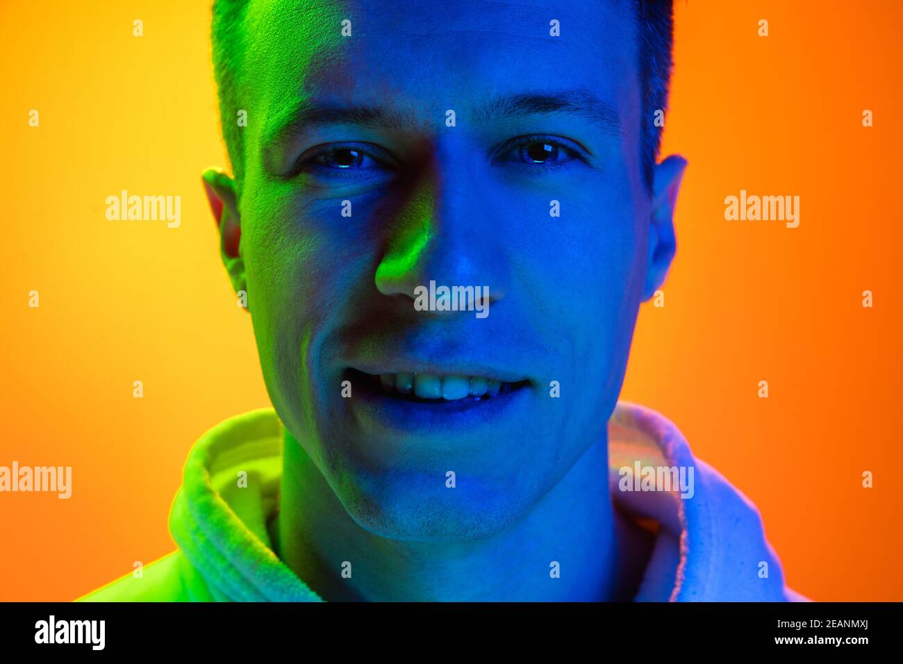 Smiling. Caucasian man's portrait isolated on yellow studio background ...