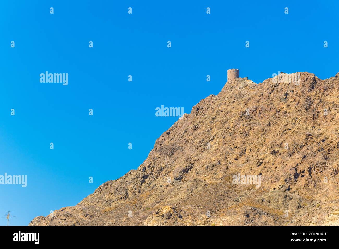 View of a watch tower on a hill in Muscat, Oman Stock Photo - Alamy