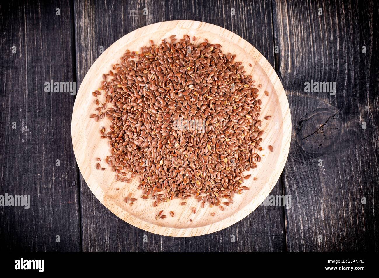 The Flax seeds in a wooden plate Stock Photo - Alamy