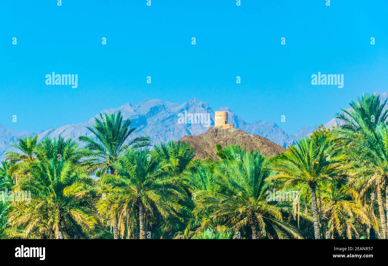 View of a watch tower in the nizwa region perched on a hill and ...