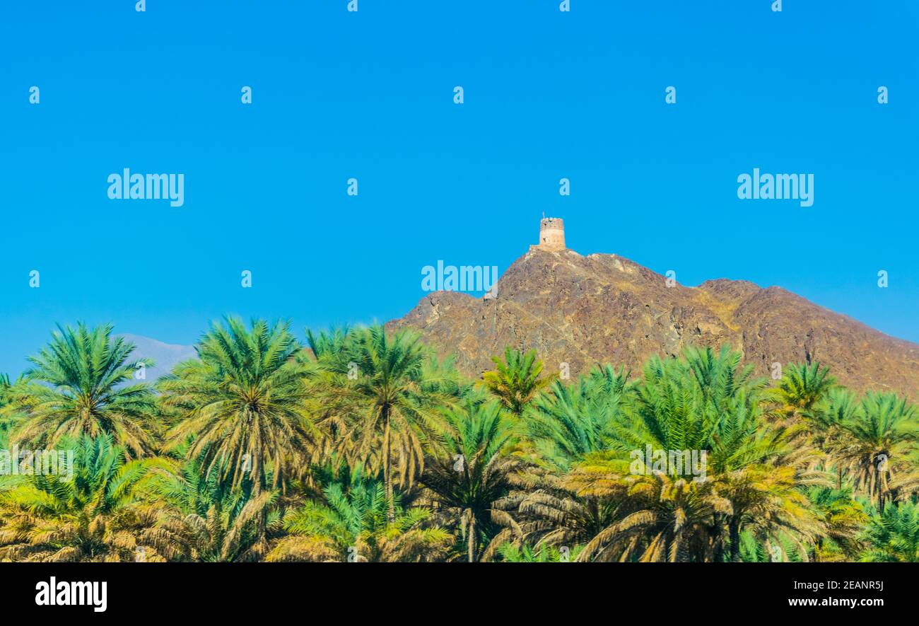 View of a watch tower in the nizwa region perched on a hill and ...