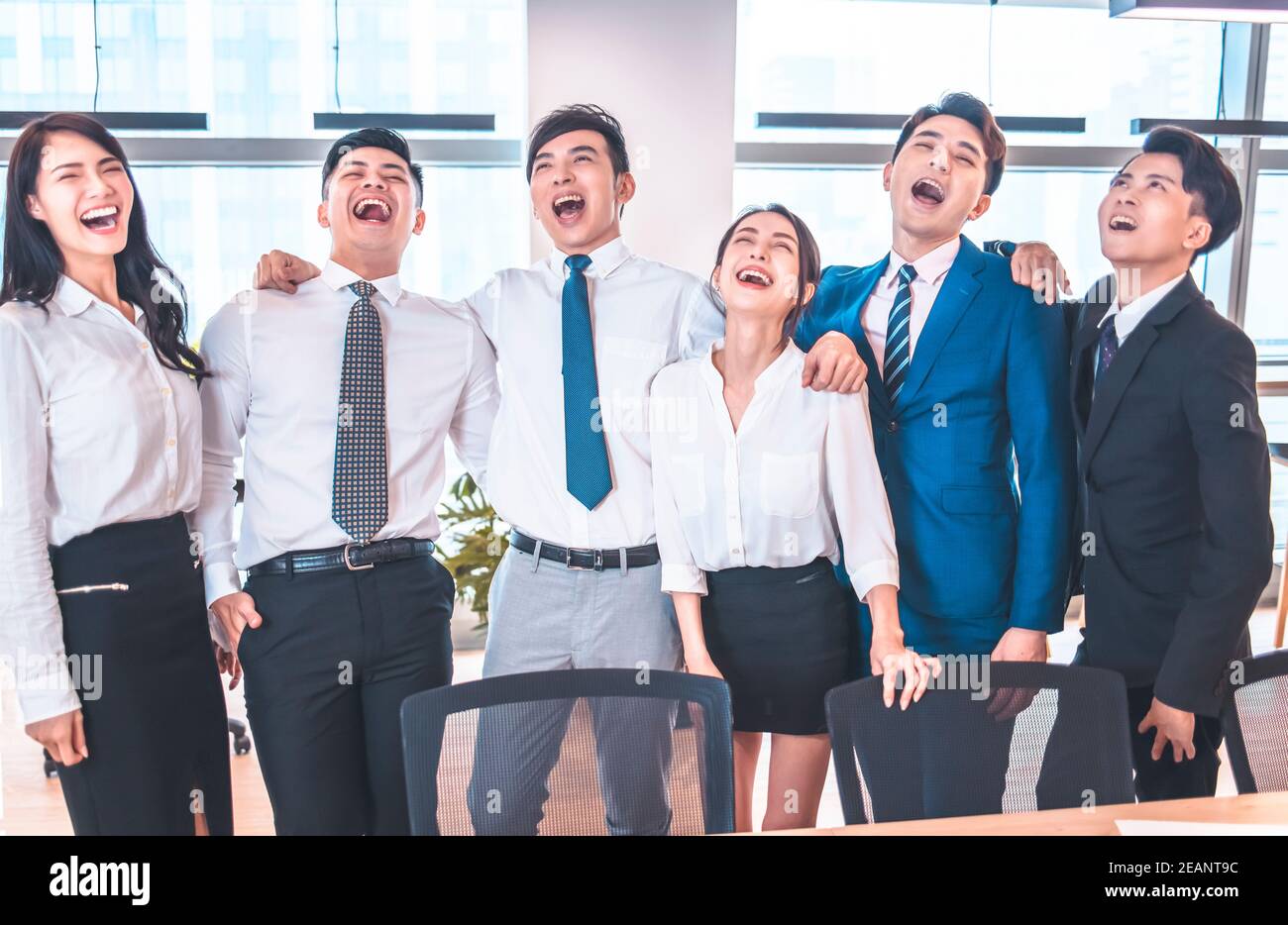 Successful business team laughing and singing together Stock Photo - Alamy Successful business team laughing and singing together Stock Photo - Alamy