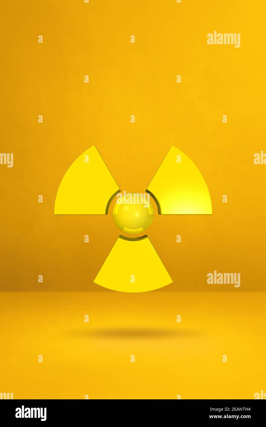 Radioactive symbol on a yellow studio background Stock Photo - Alamy