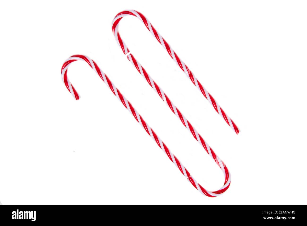 Red and white striped candy canes on a peppermint background hi-res ...