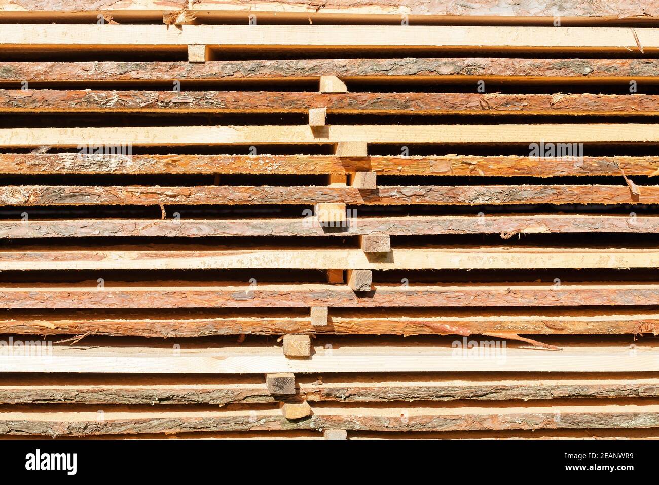 Stacked boards. Industrial background from stack wood Stock Photo - Alamy