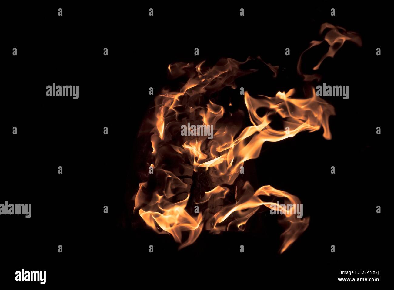 A blazing fire in the dark. Inflammation of firewood in the fire. A ...