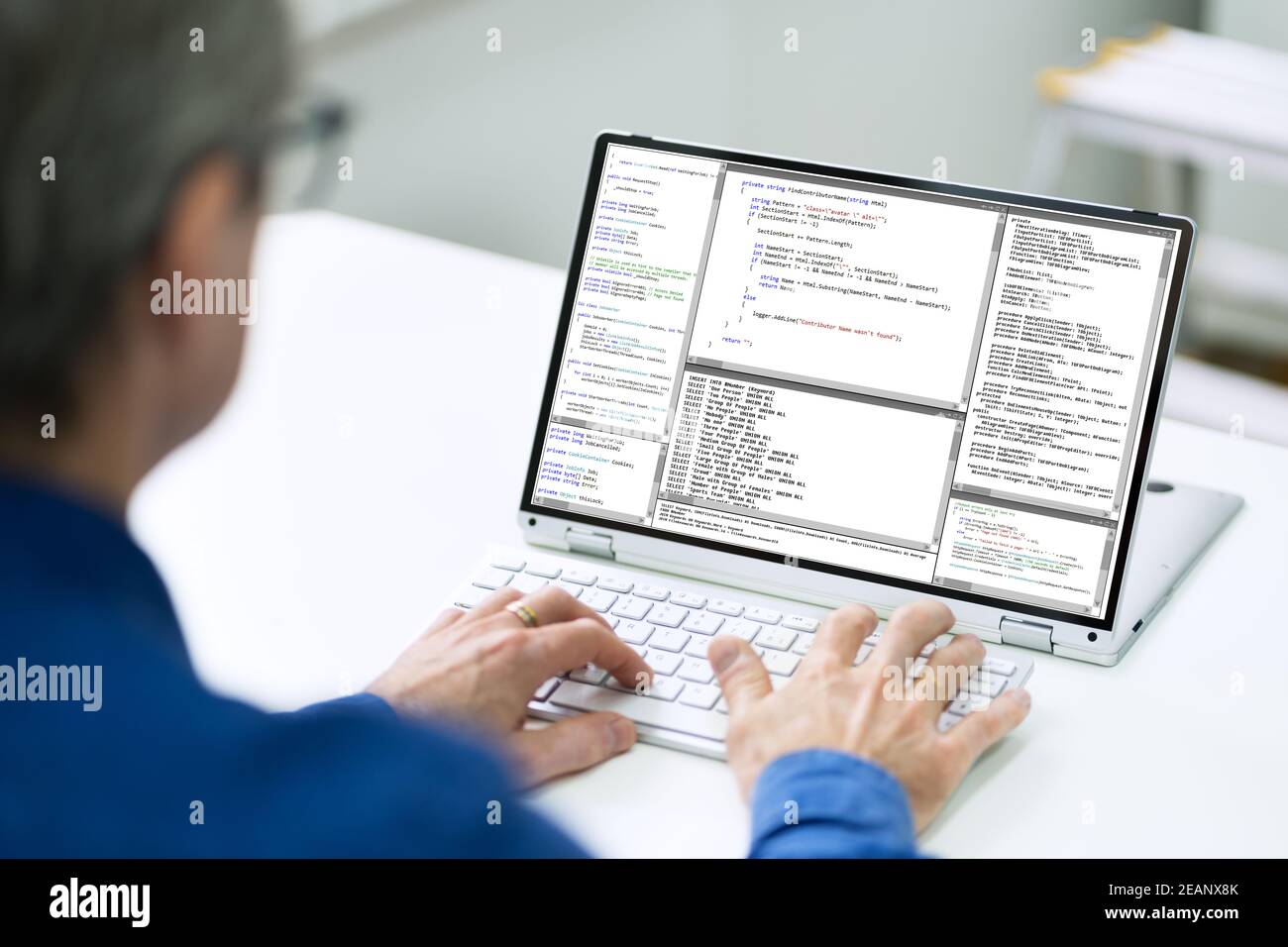 Programmer Man Coder With Code On Screen Stock Photo - Alamy