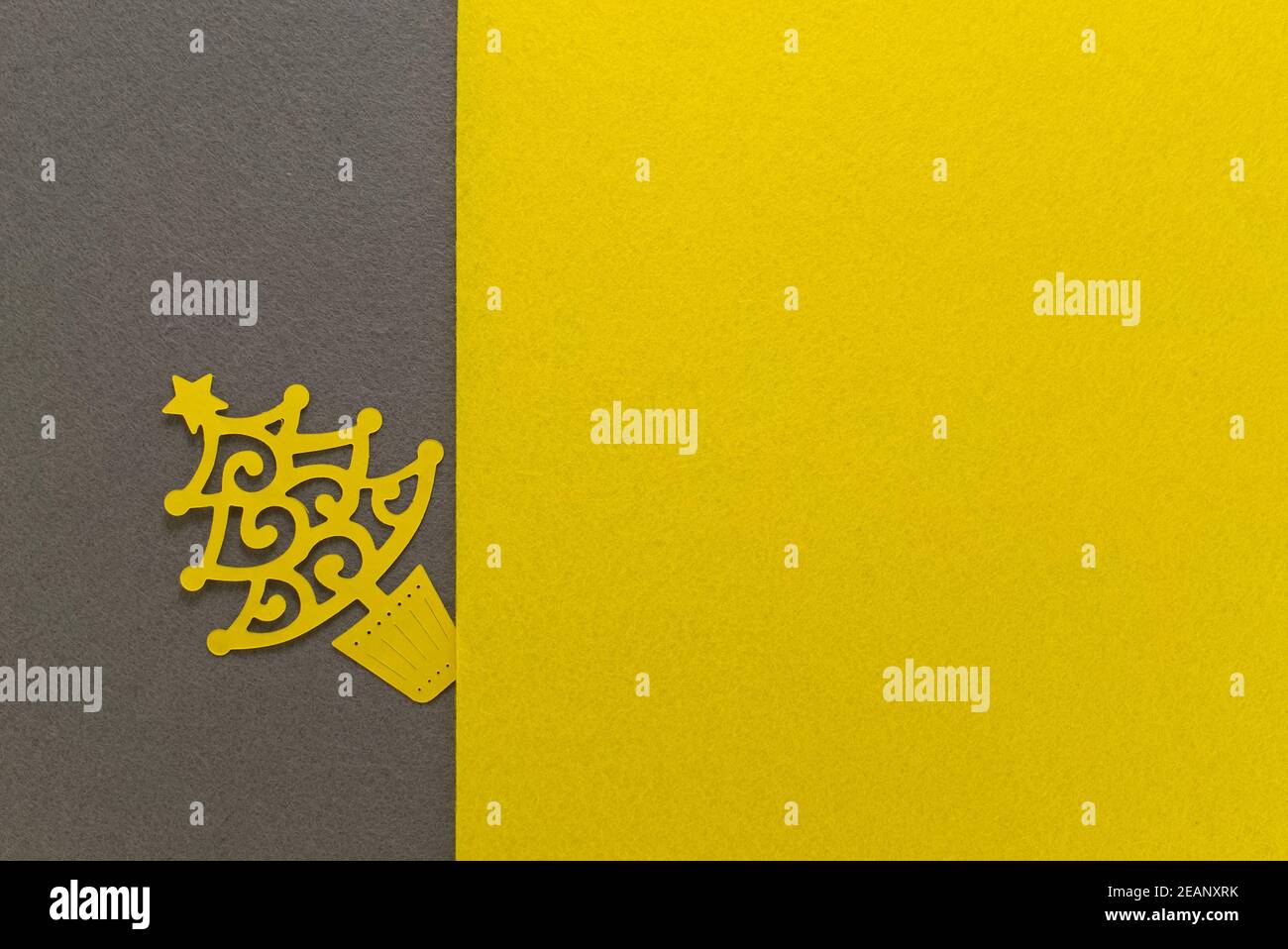 Paper cut Christmas tree on grey yellow Stock Photo - Alamy