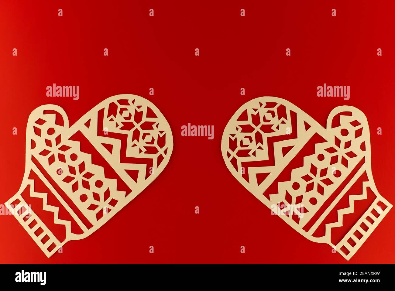 Paper cut gloves on festive red background Stock Photo - Alamy