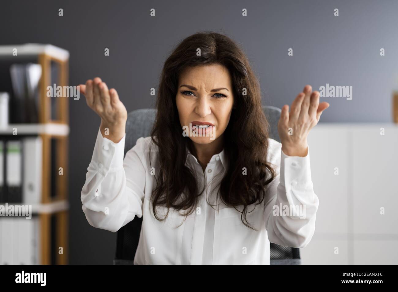Workplace Quarrel. Angry Looking Woman Stock Photo - Alamy