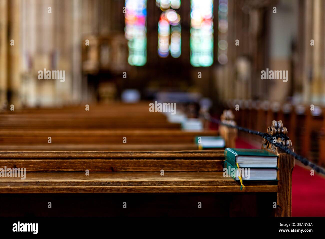 bible on an empty pew in a church before a service Stock Photo - Alamy