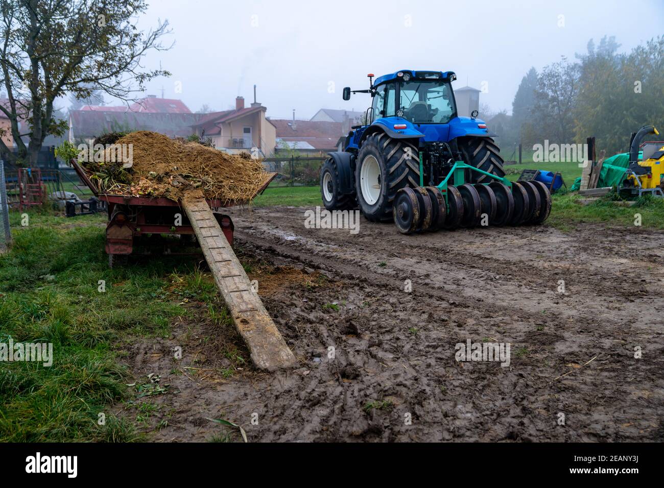 tractor on a farm in the countryside Stock Photo - Alamy