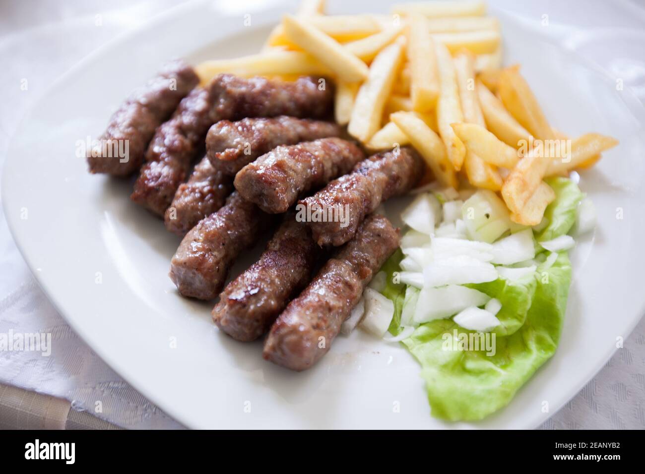 Traditional grilled meat kebab with french fries Stock Photo - Alamy