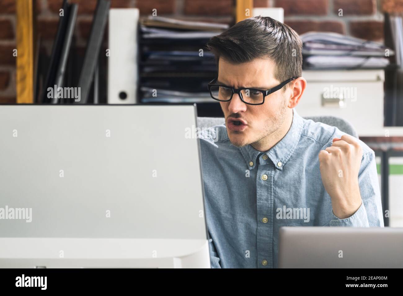 Workplace Quarrel. Angry Looking Man Stock Photo - Alamy