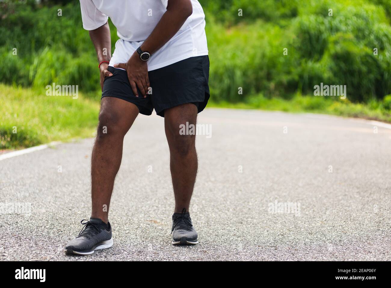 sport runner black man wear watch hands joint hold leg she has thigh ...