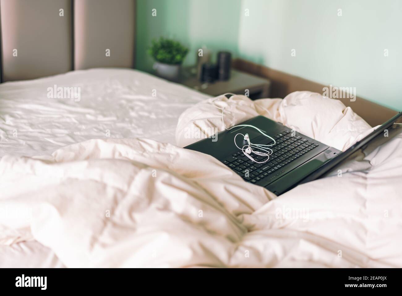 laptop in the bed on white sheets in morning time Stock Photo - Alamy