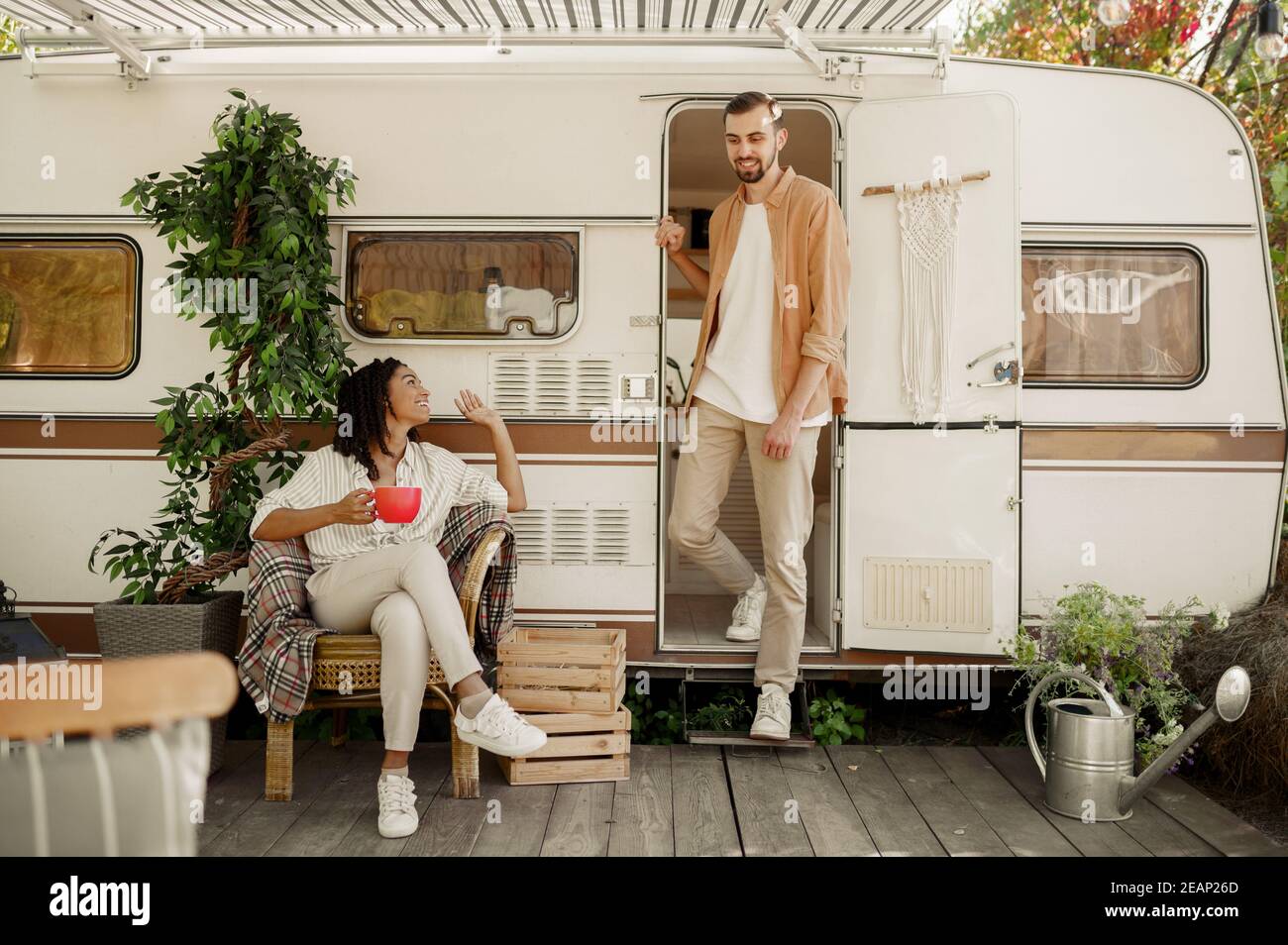 Love couple relaxing in rv, camping in a trailer Stock Photo - Alamy