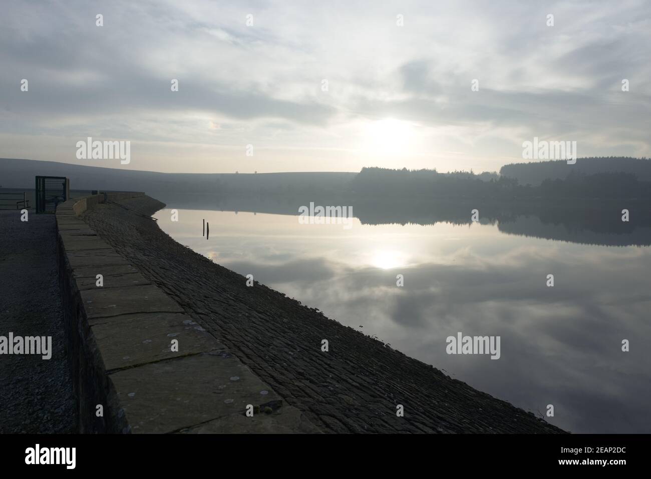 Sunset image of the curved dam wall at redmires reservoirs Stock Photo ...