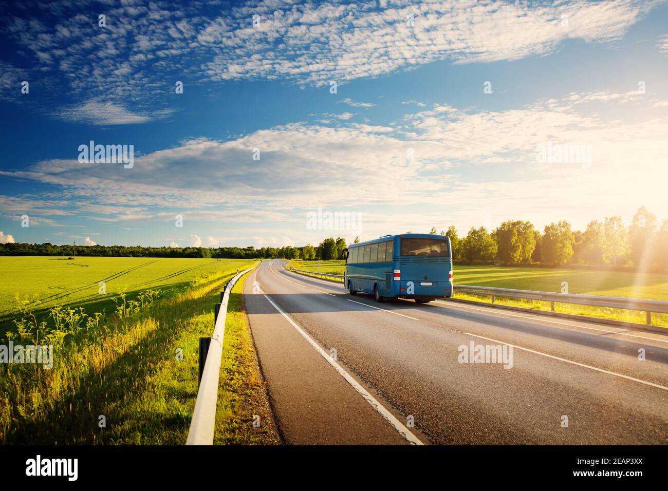 Bus on asphalt road in beautiful spring day Stock Photo - Alamy