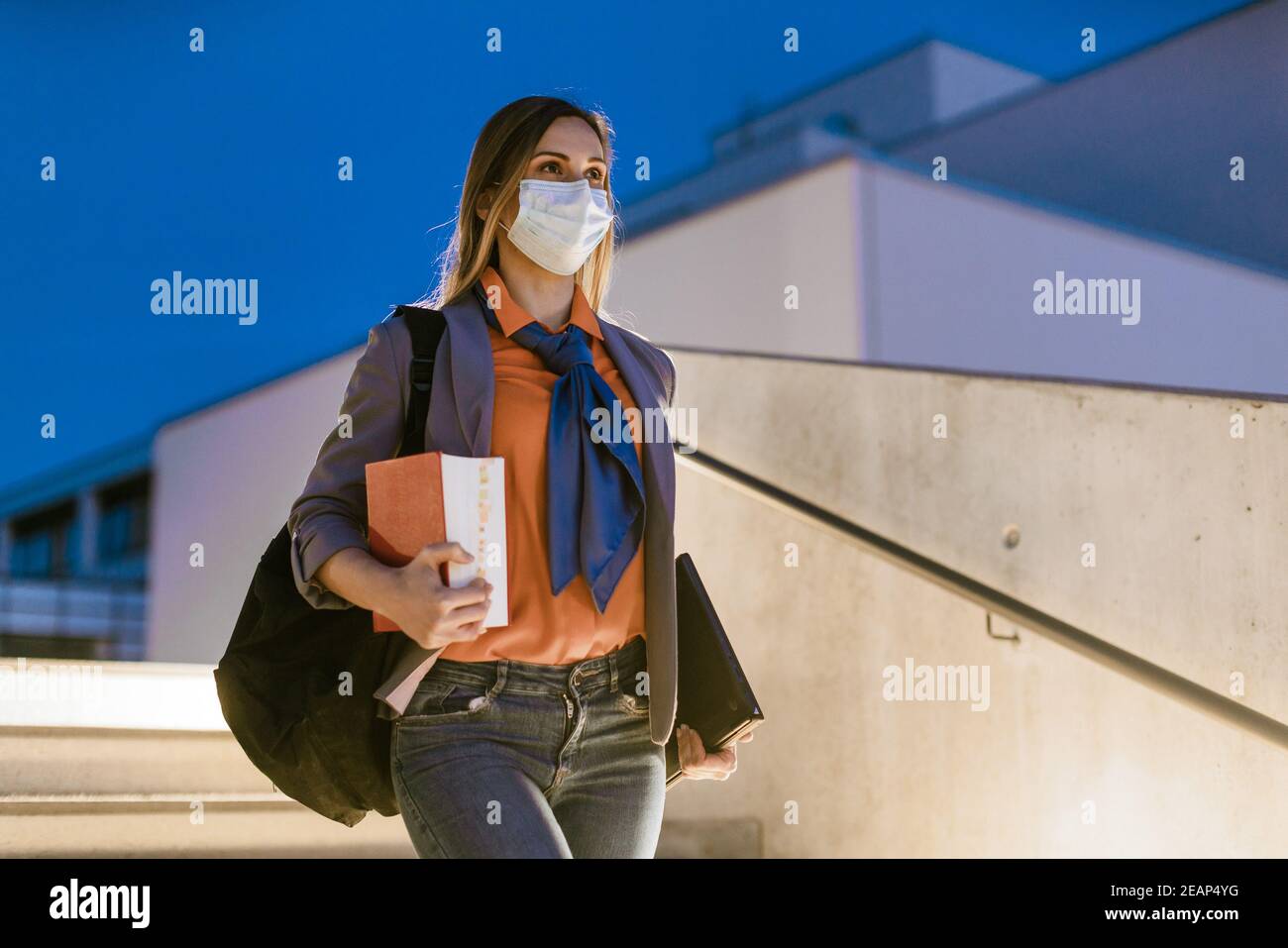 Lonely student woman on college campus closed due to covid 19 Stock ...