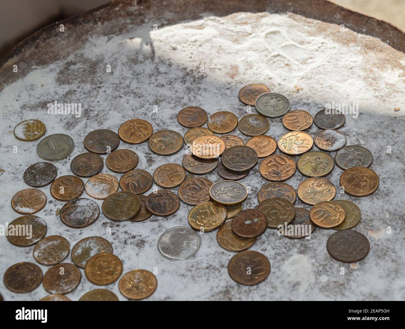 Coins in the flour in the balance. Rubles and kopecks Stock Photo - Alamy