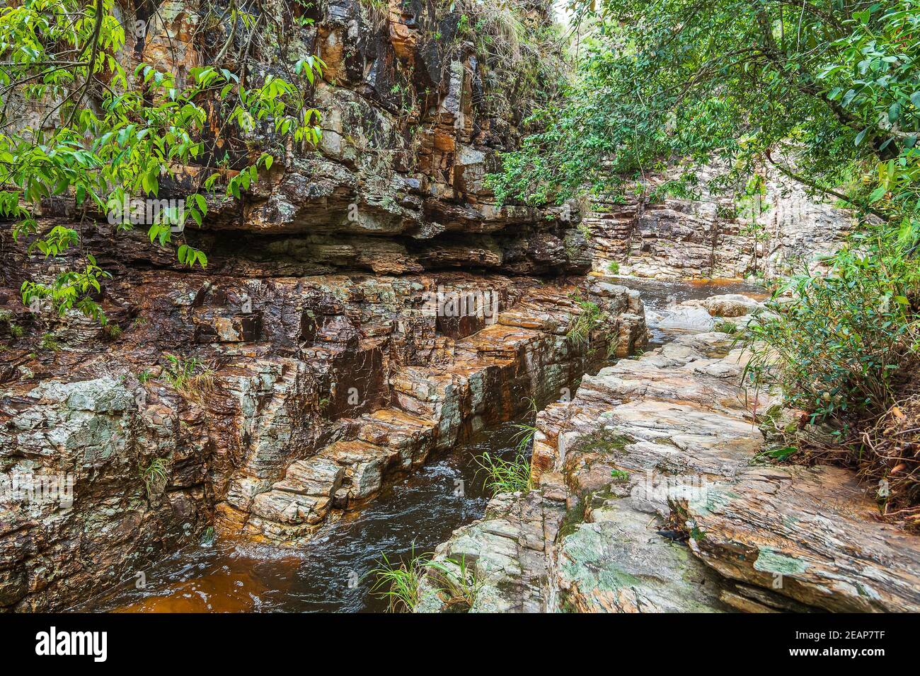 Sedimentary rock wall with a river passing by the rocks, eco tourism ...