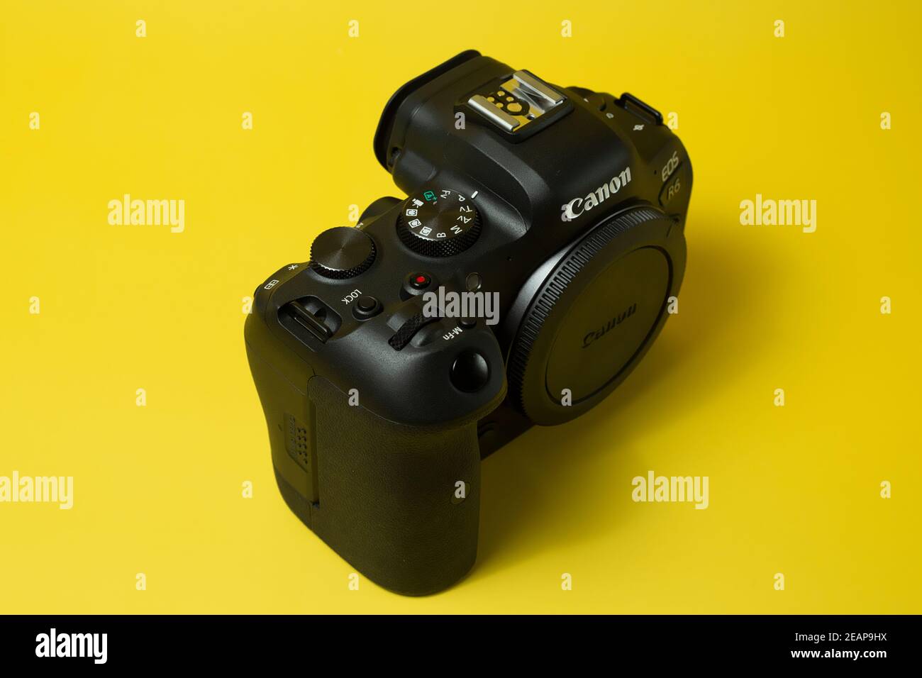 Canon r6 digital camera close-up, yellow background, glare Stock Photo ...
