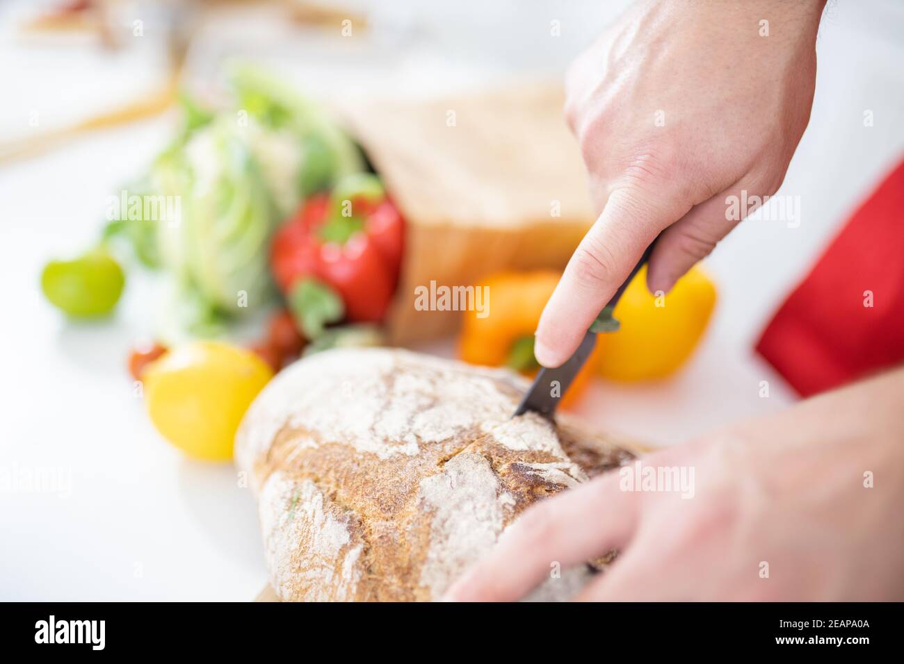 Male cutting bread hi-res stock photography and images - Alamy