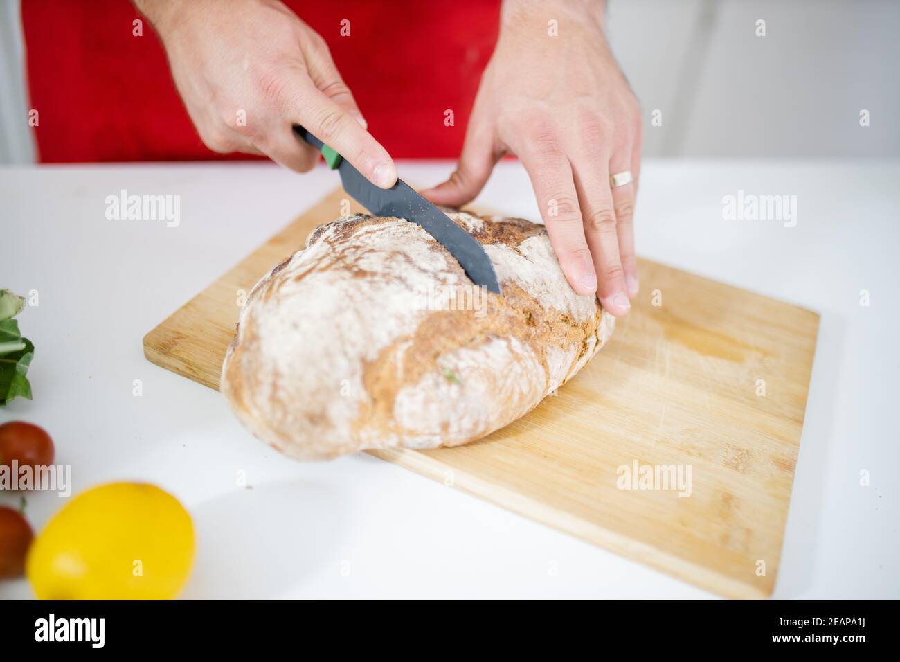 Male cutting bread hi-res stock photography and images - Alamy