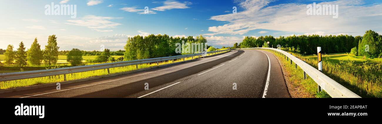 Road panorama on sunny spring evening Stock Photo - Alamy