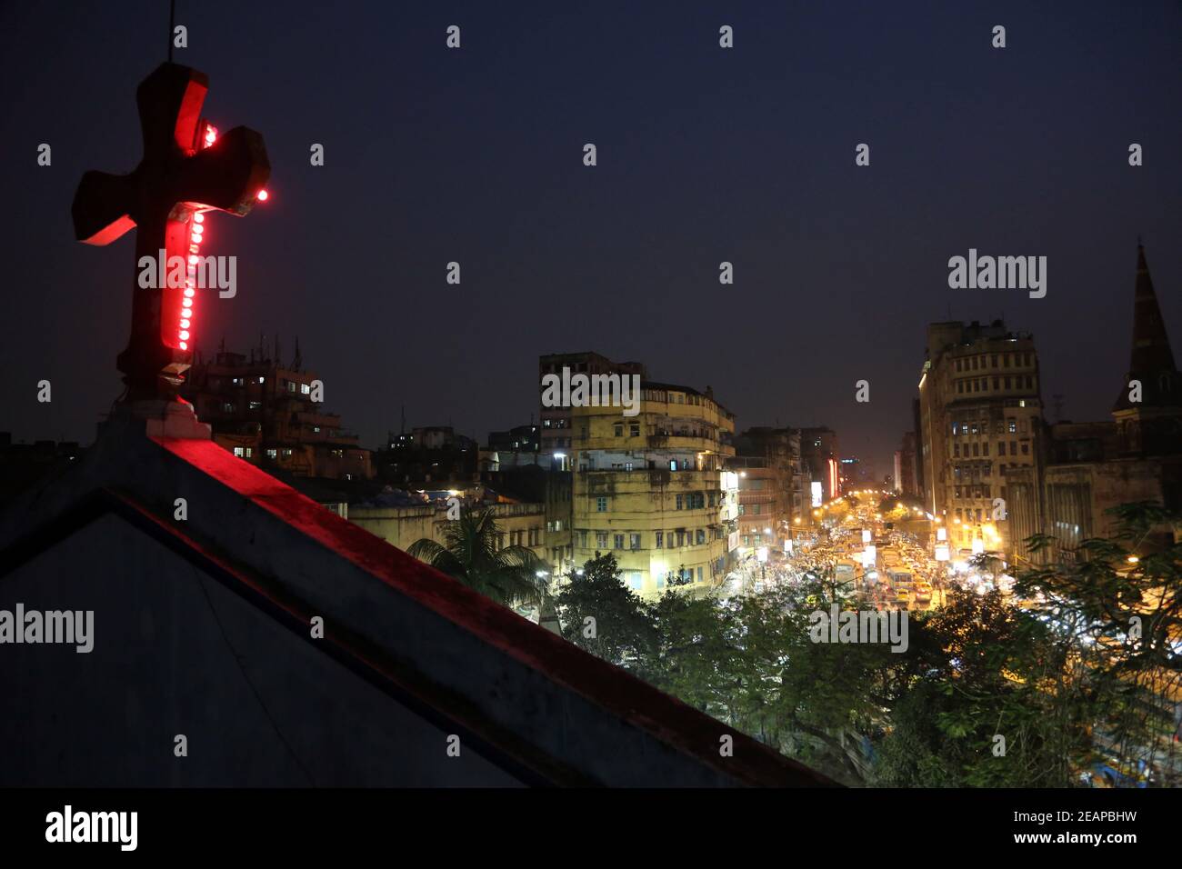 Dark city traffic blurred in motion at late evening on crowded streets ...