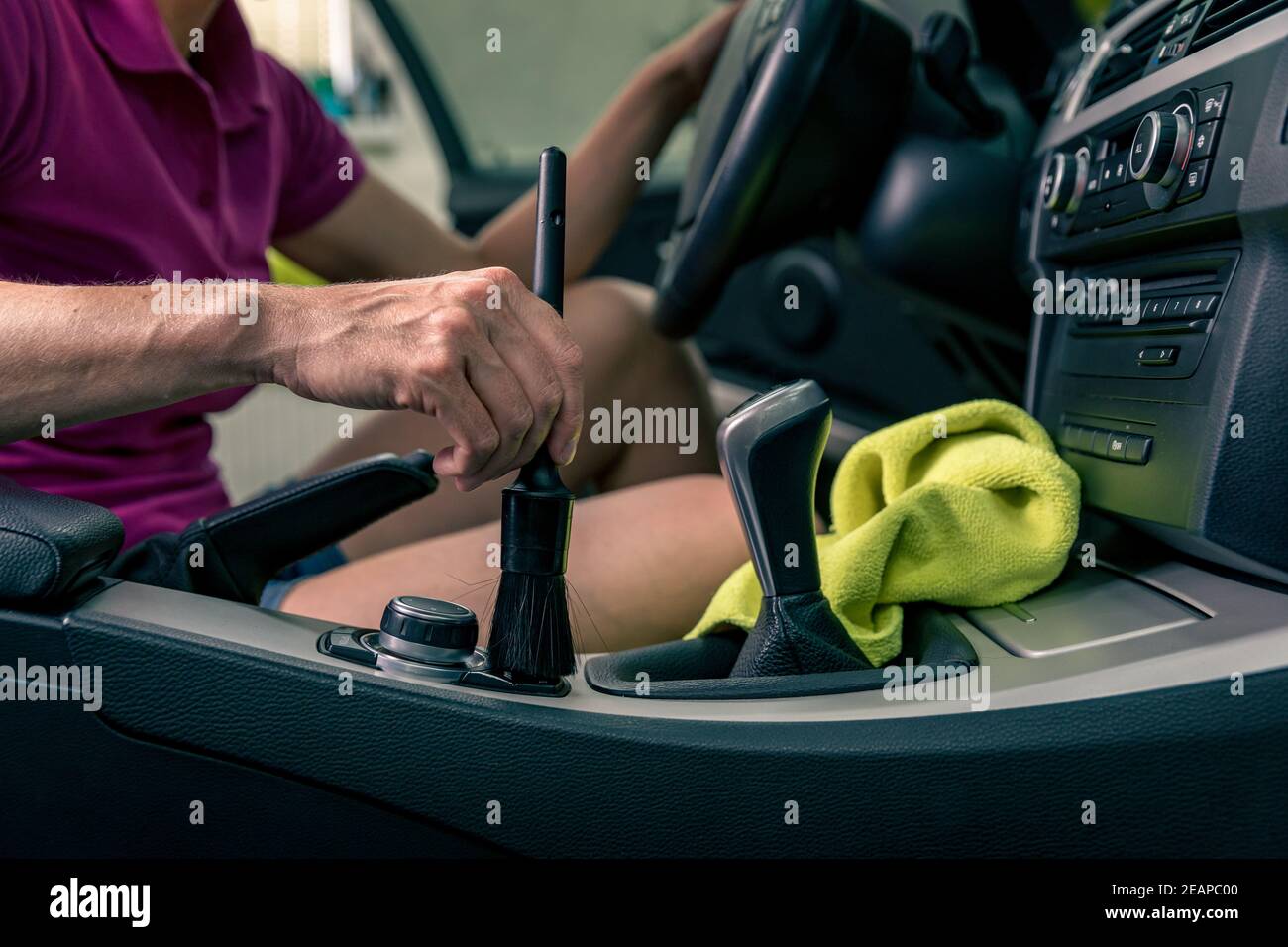manual cleaning of the car interior with the help of brushing Stock ...