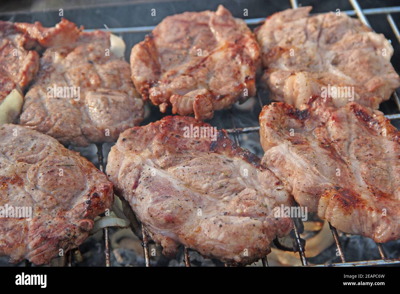Cooking the meat on the barbecue hi-res stock photography and images ...