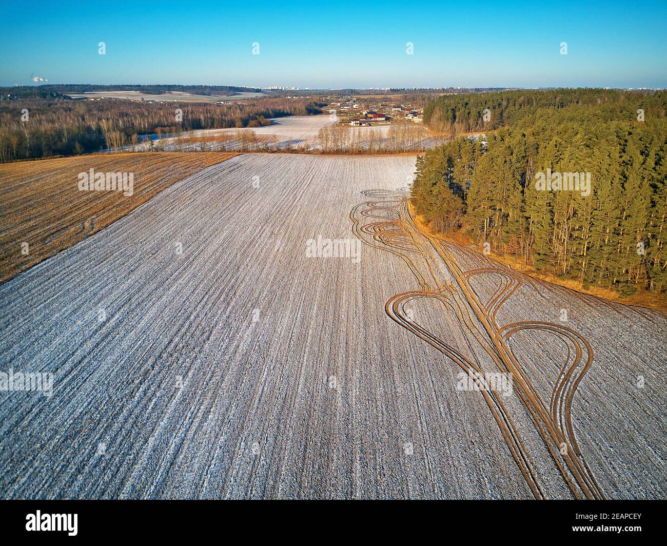 Winter Agricultural field under snow. Aerial scene. December Rural ...