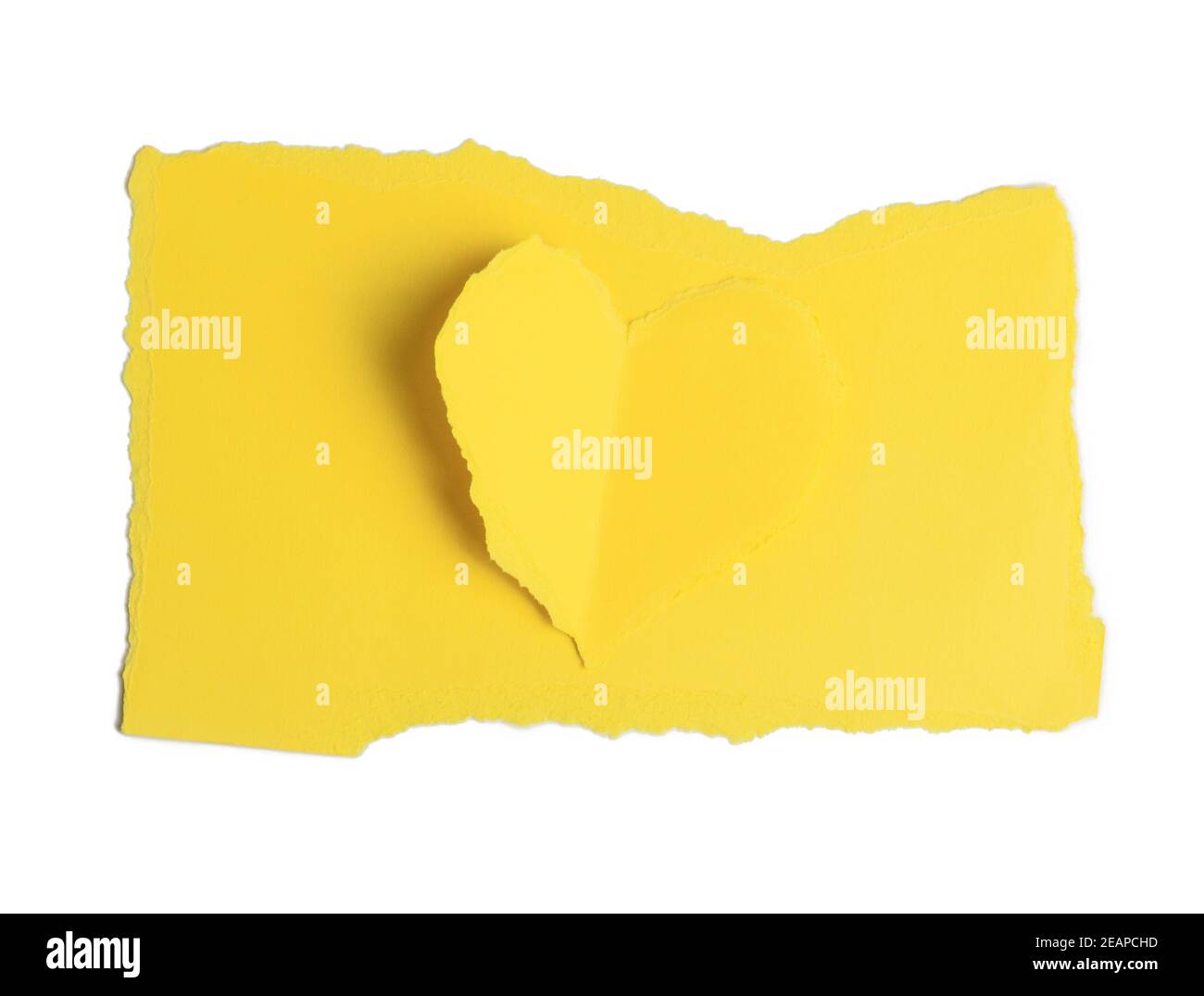 heart made of yellow paper and a piece of torn yellow cardboard Stock ...