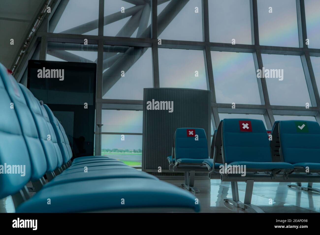 Empty seat in departure lounge at airport terminal. Distance for one ...