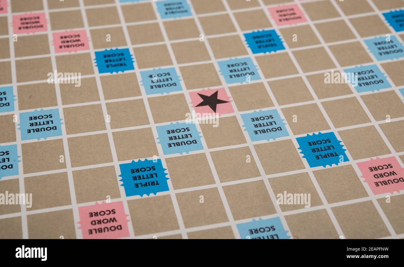 Scrabble gameboard closeup view making background Stock Photo - Alamy