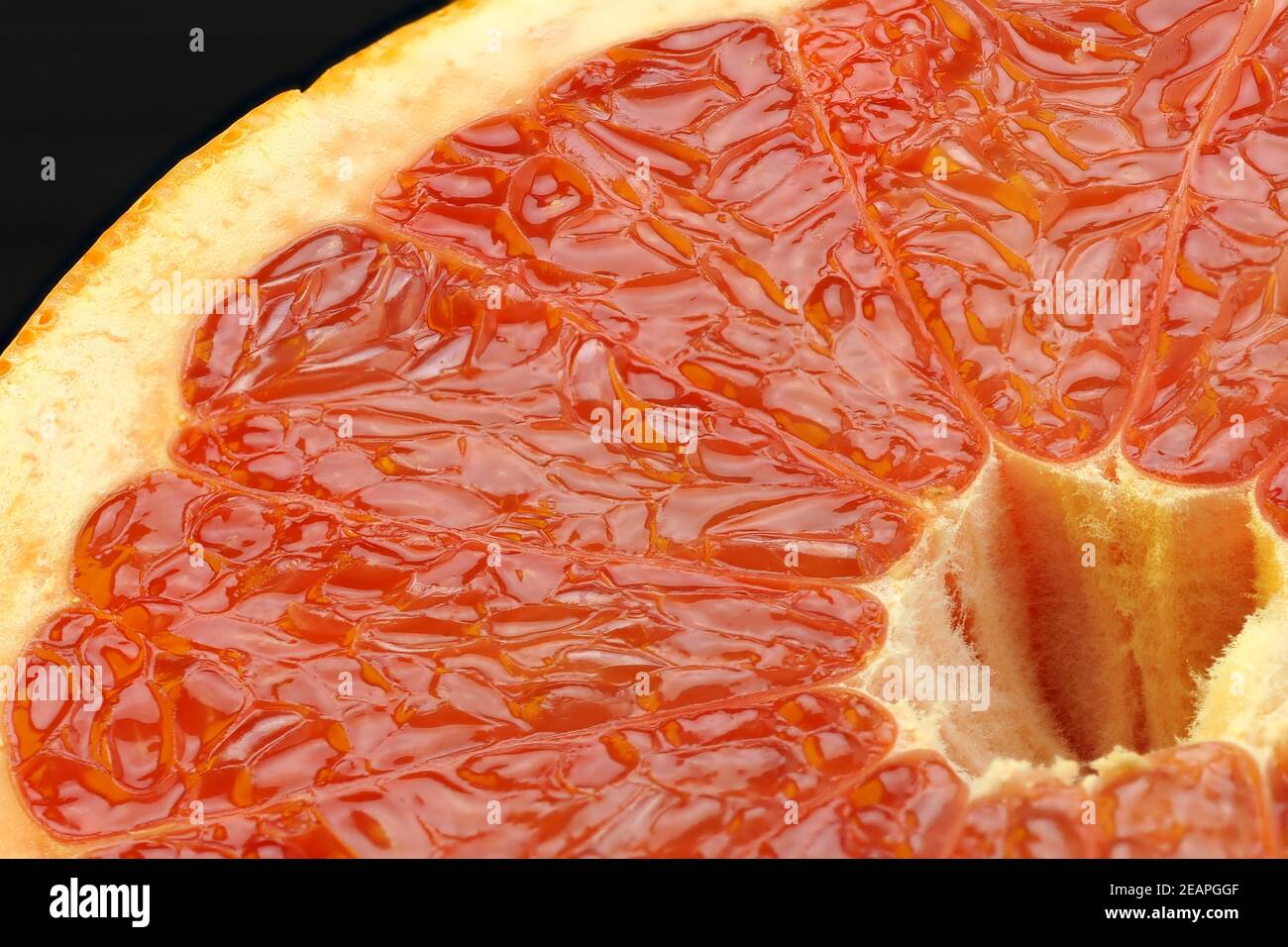 Food. A macro-beam of ripe grapefruit cut. The texture of citrus fruits ...