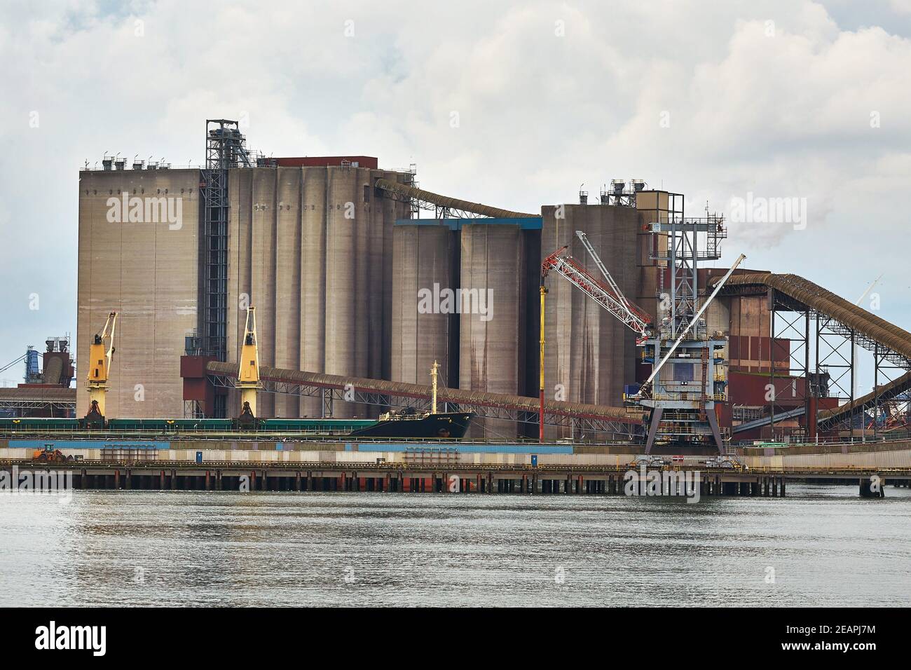 Industrial harbor with rusty structures Stock Photo - Alamy