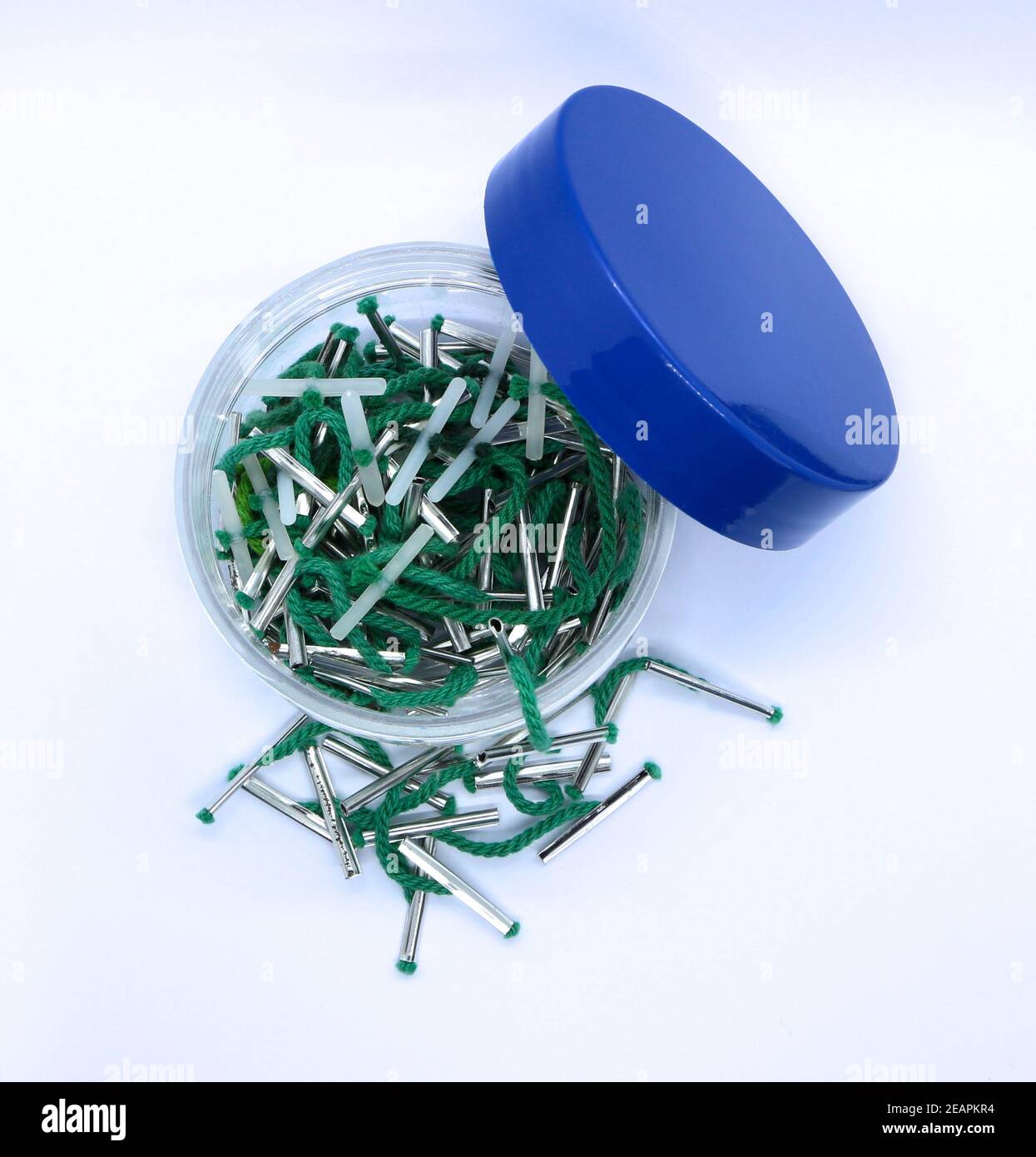 Photo of Treasury tags in a transparent round plastic box with a blue ...