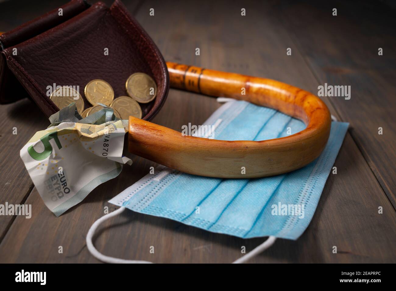 Old age and pandemic concept with money and cane Stock Photo - Alamy