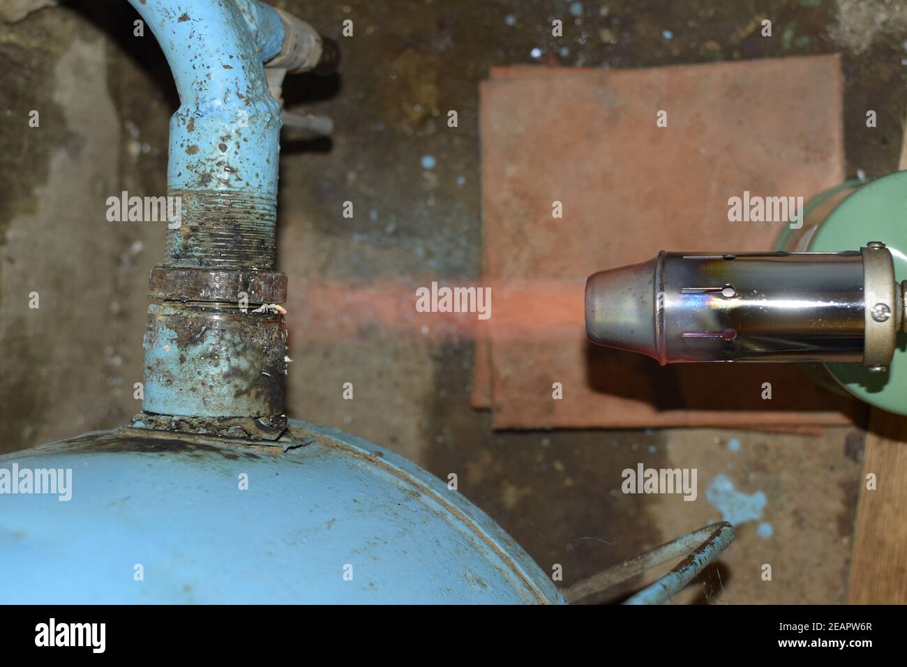 Heating a steel pipe with a blowtorch. The flame of a blowtorch Stock ...