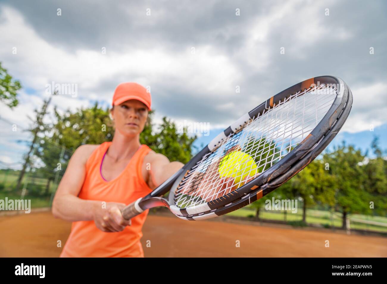 close up shot of a tennis racket in a players hand Stock Photo - Alamy