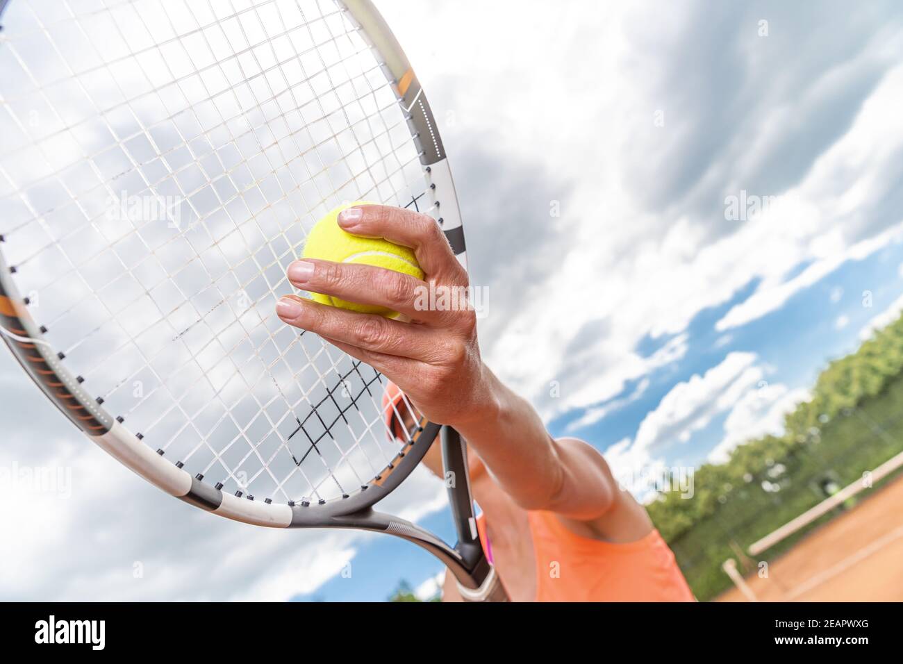 close up shot of a tennis racket in a players hand Stock Photo - Alamy