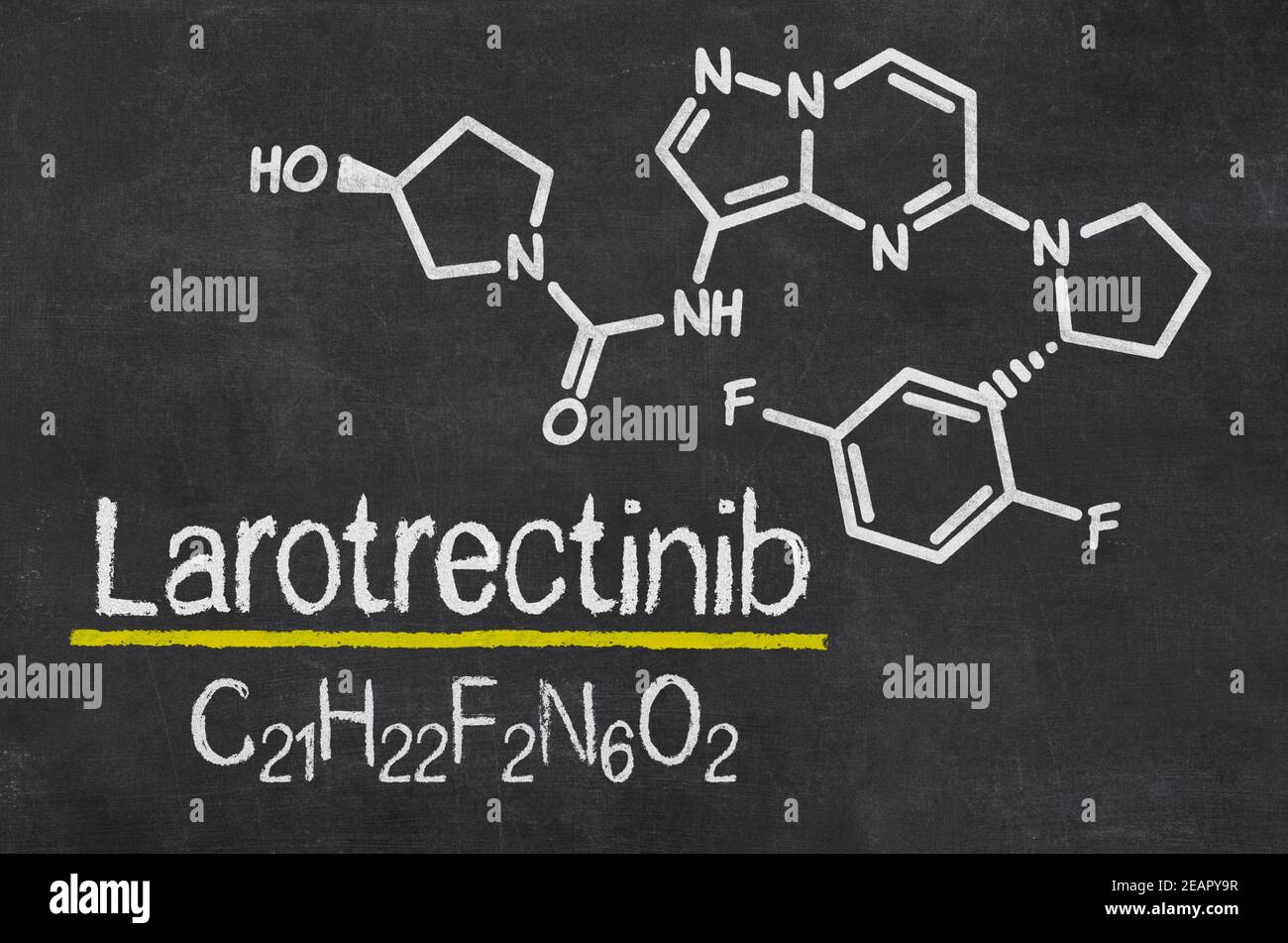Blackboard with the chemical formula of Larotrectinib Stock Photo - Alamy