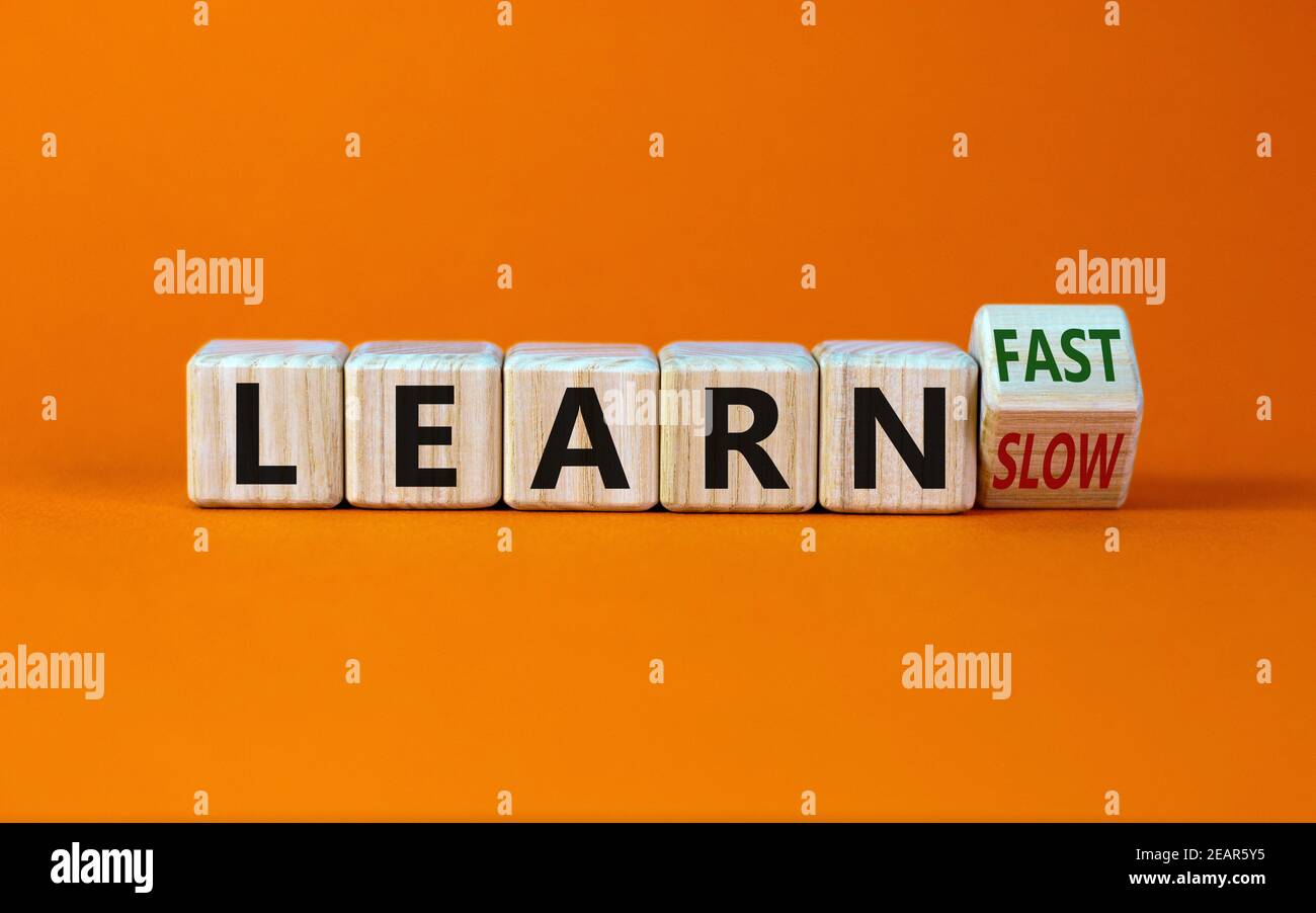 Learn slow or fast symbol. Turned wooden cubes and changed words 'learn ...