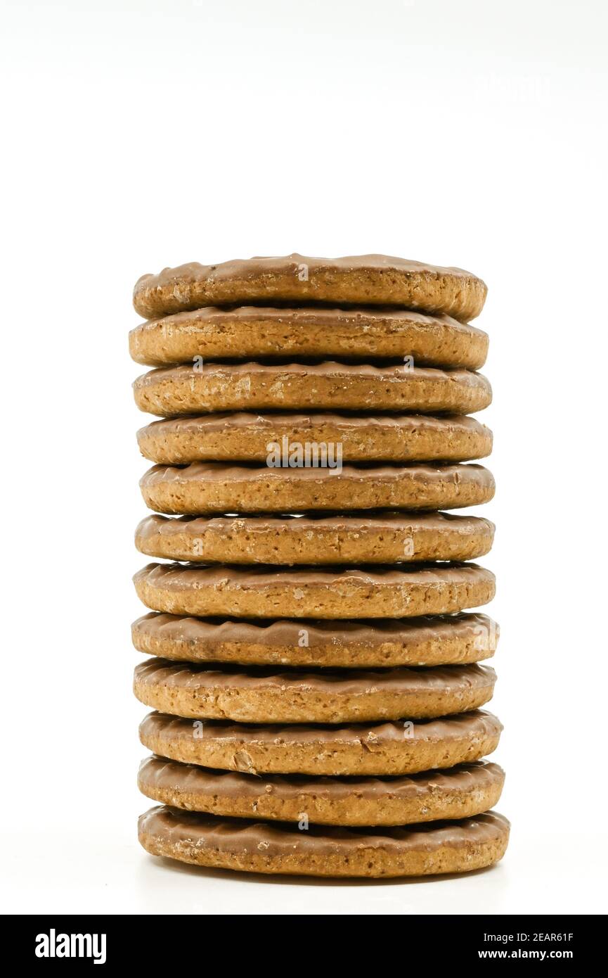 Stack of chocolate covered biscuits against a plain white background ...