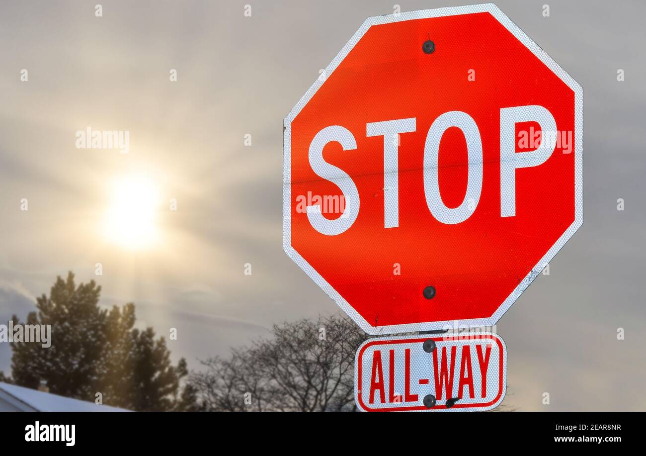 Traffic stop sign in Winter Stock Photo - Alamy